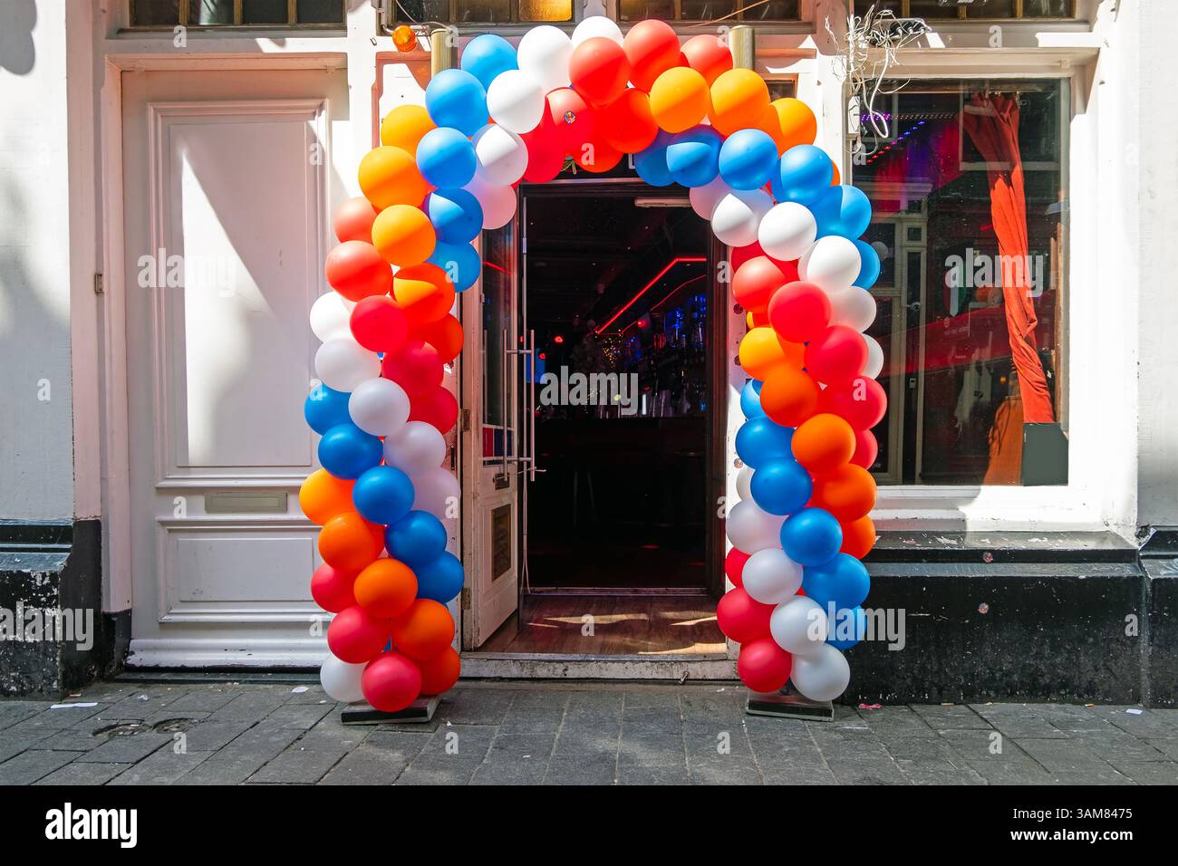 Typical dutch cafe decorated with red, white and blue balloons at kings ...