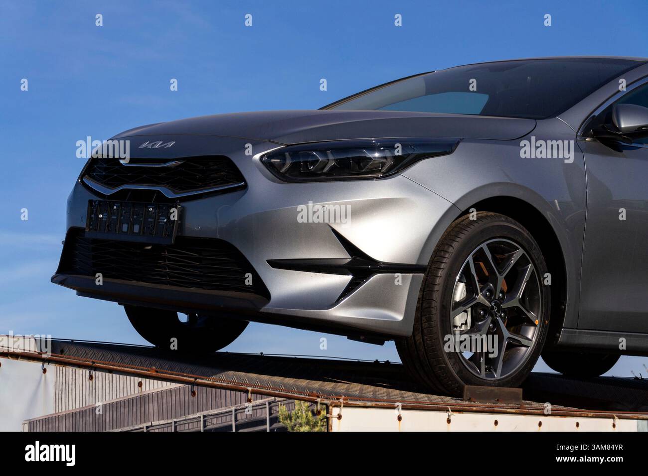 Kia motors company logo on Ceed car in front of dealership building on ...