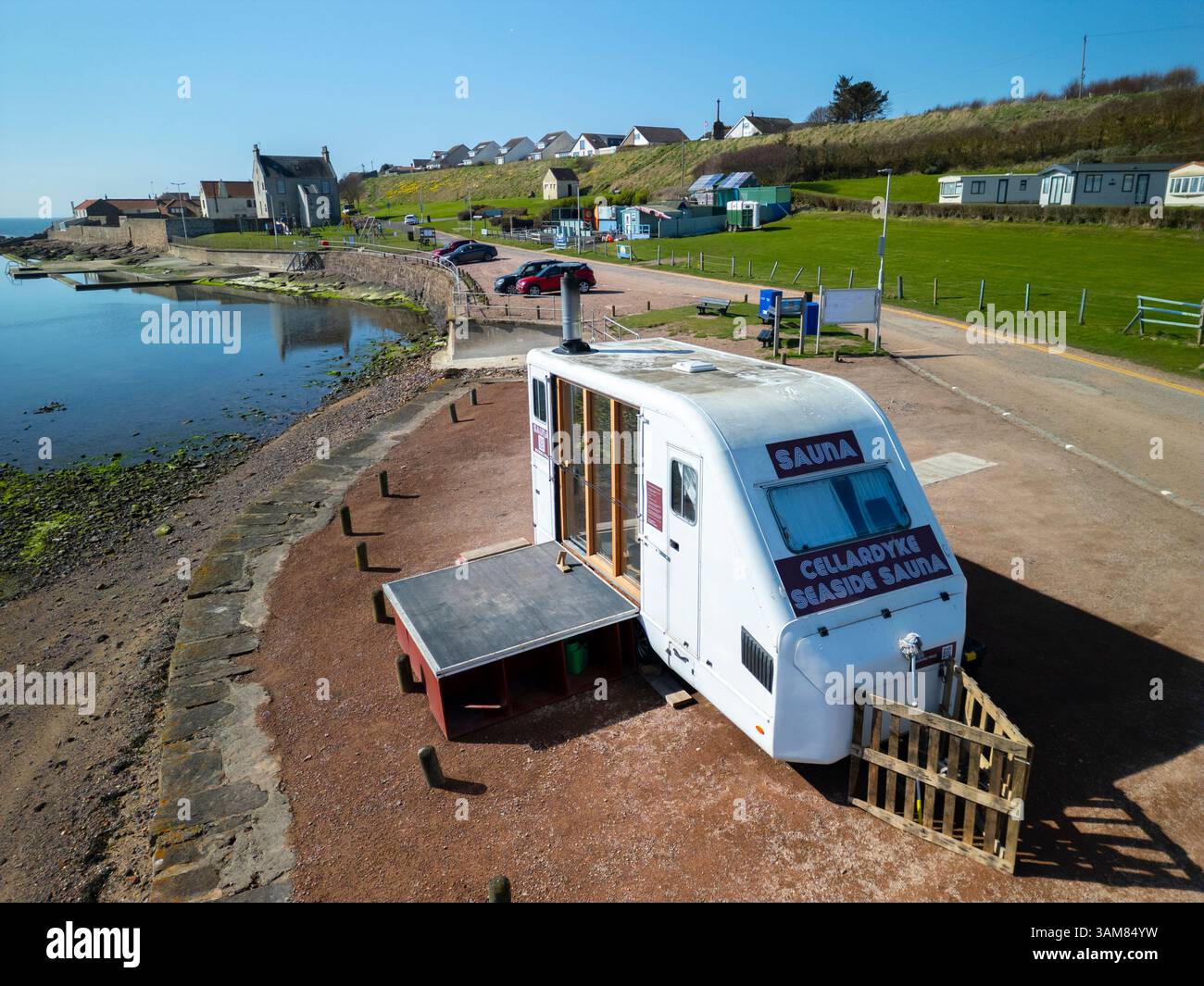 Aerial view from drone of Cellardyke Seaside Sauna in converted caravan ...
