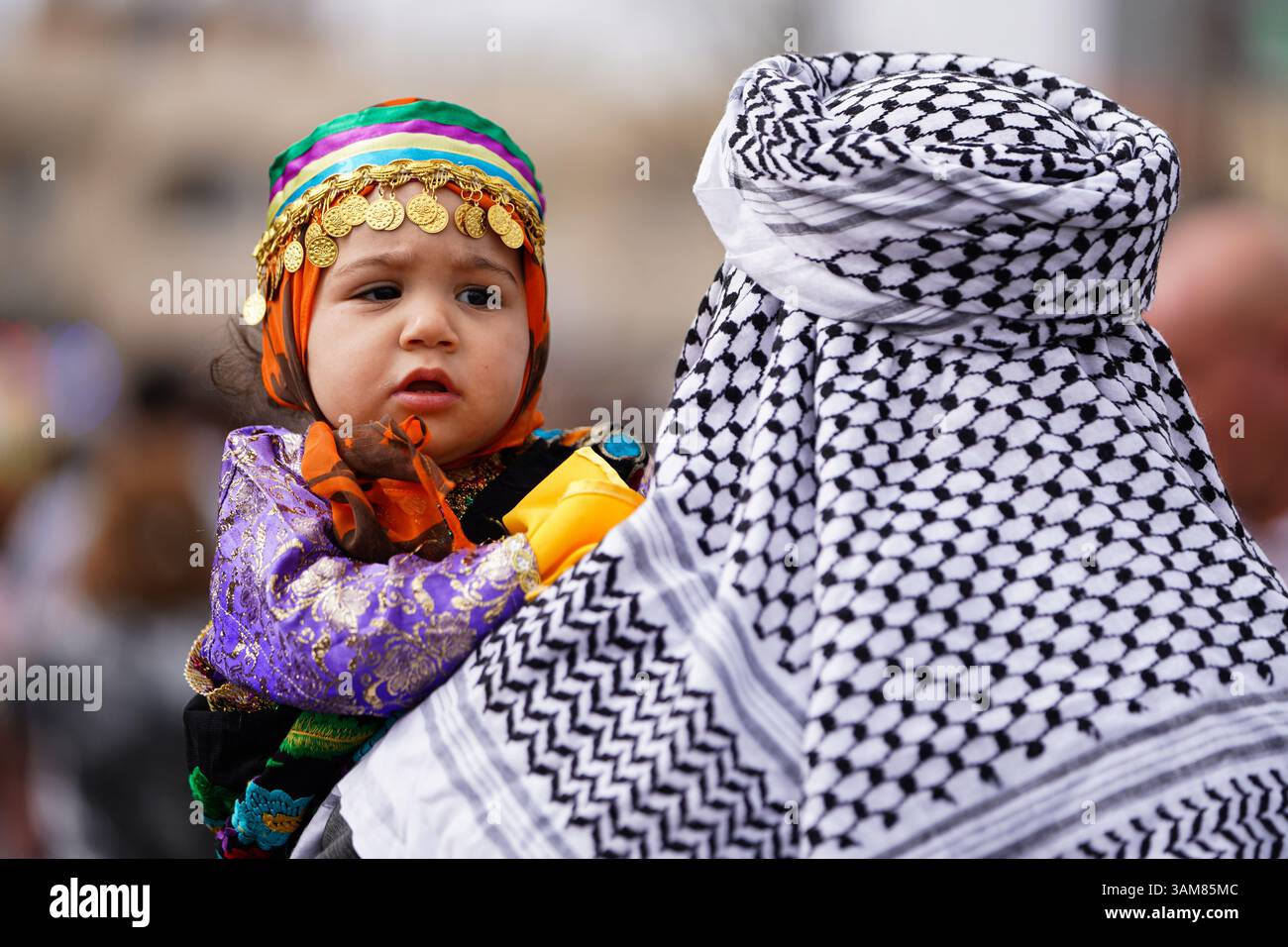 Al Hamdaniya, Iraq. 13th Apr, 2025. A child dressed in a folkloric ...