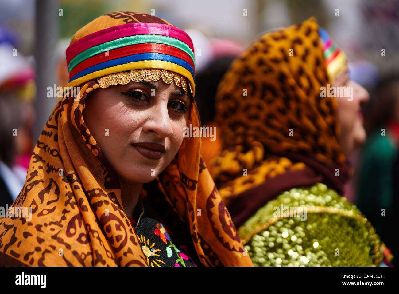 An Iraqi Christian woman wears folkloric costume during the Palm Sunday ...