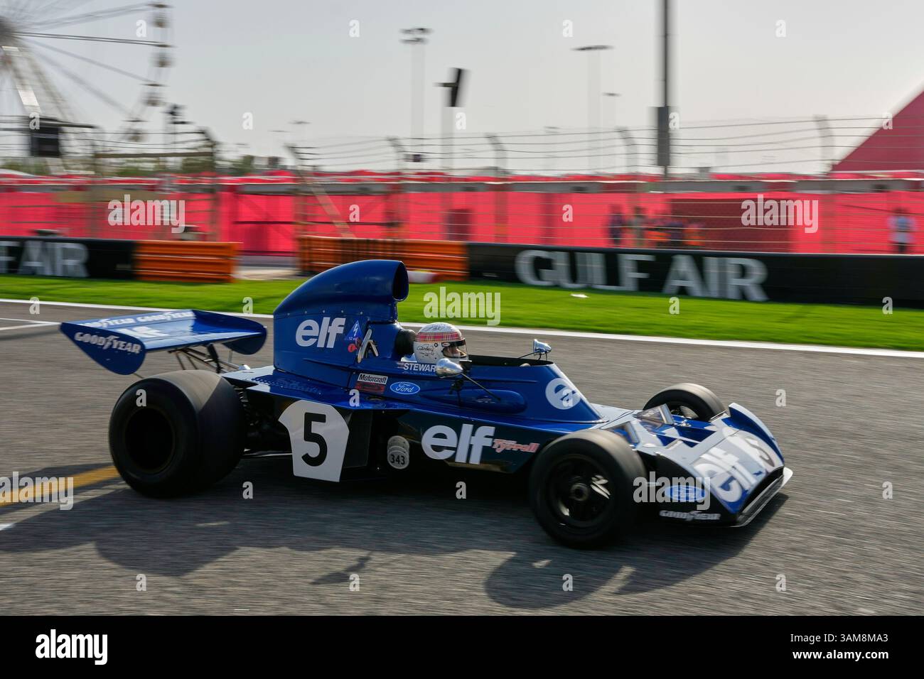 Former Formula One champion Jackie Stewart drives his original car ...