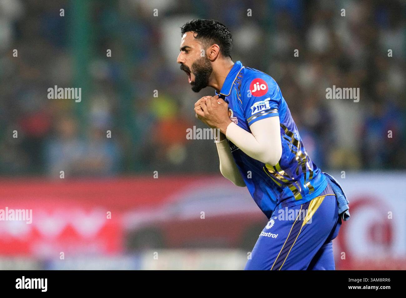 Mumbai Indians' Naman Dhir takes the catch to Delhi Capitals' Tristan ...