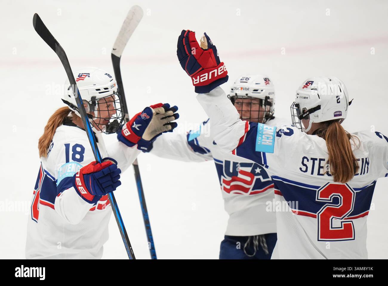 United States' Lee Stecklein, right, celebrates with teammates after ...