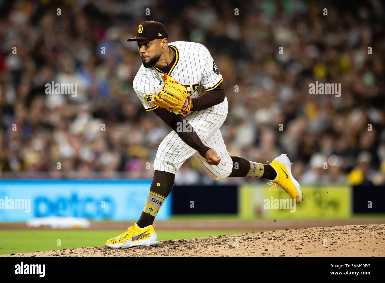 San Diego Padres' Robert Suarez follows through on a pitch against the ...