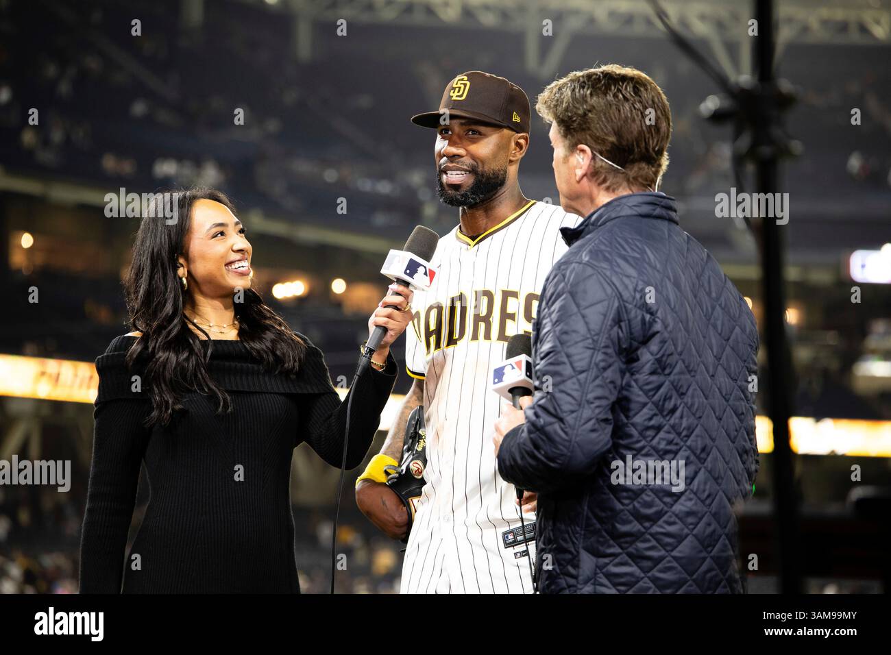 San Diego Padres' Jason Heyward, center, is interviewed by Mariluz Cook ...