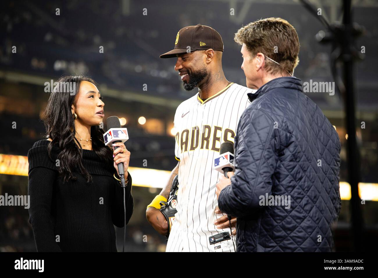 San Diego Padres' Jason Heyward, center, is interviewed by Mariluz Cook ...