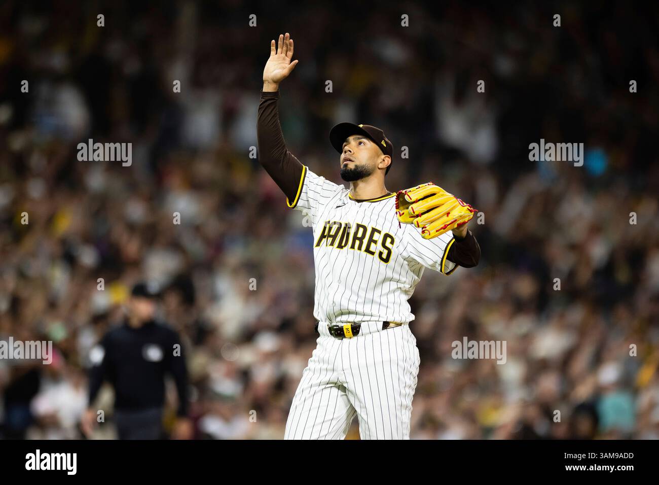 San Diego Padres relief pitcher Robert Suarez gestures to the sky after ...