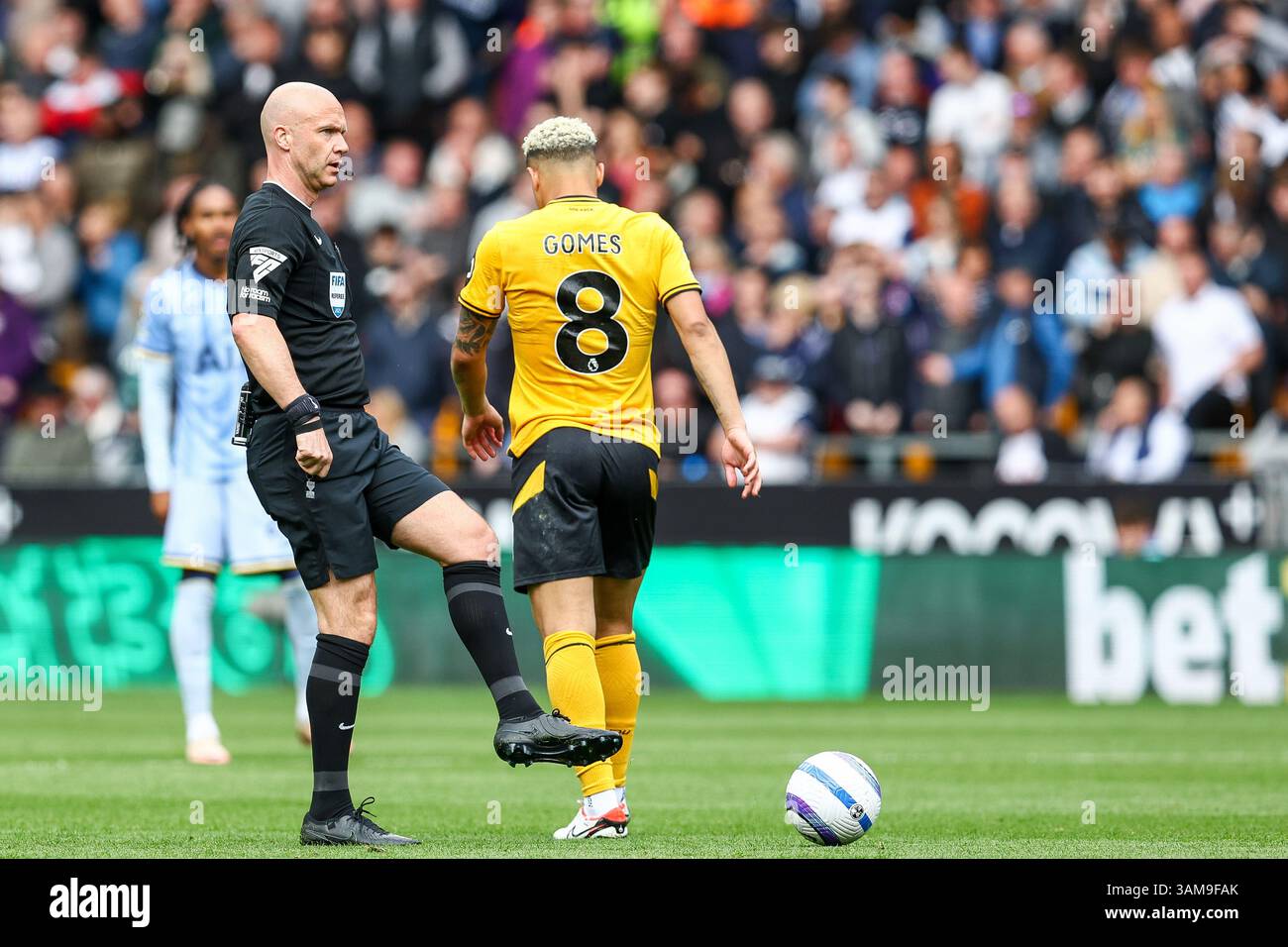 Referee, Anthony Taylor kicks the ball during the Premier League match ...