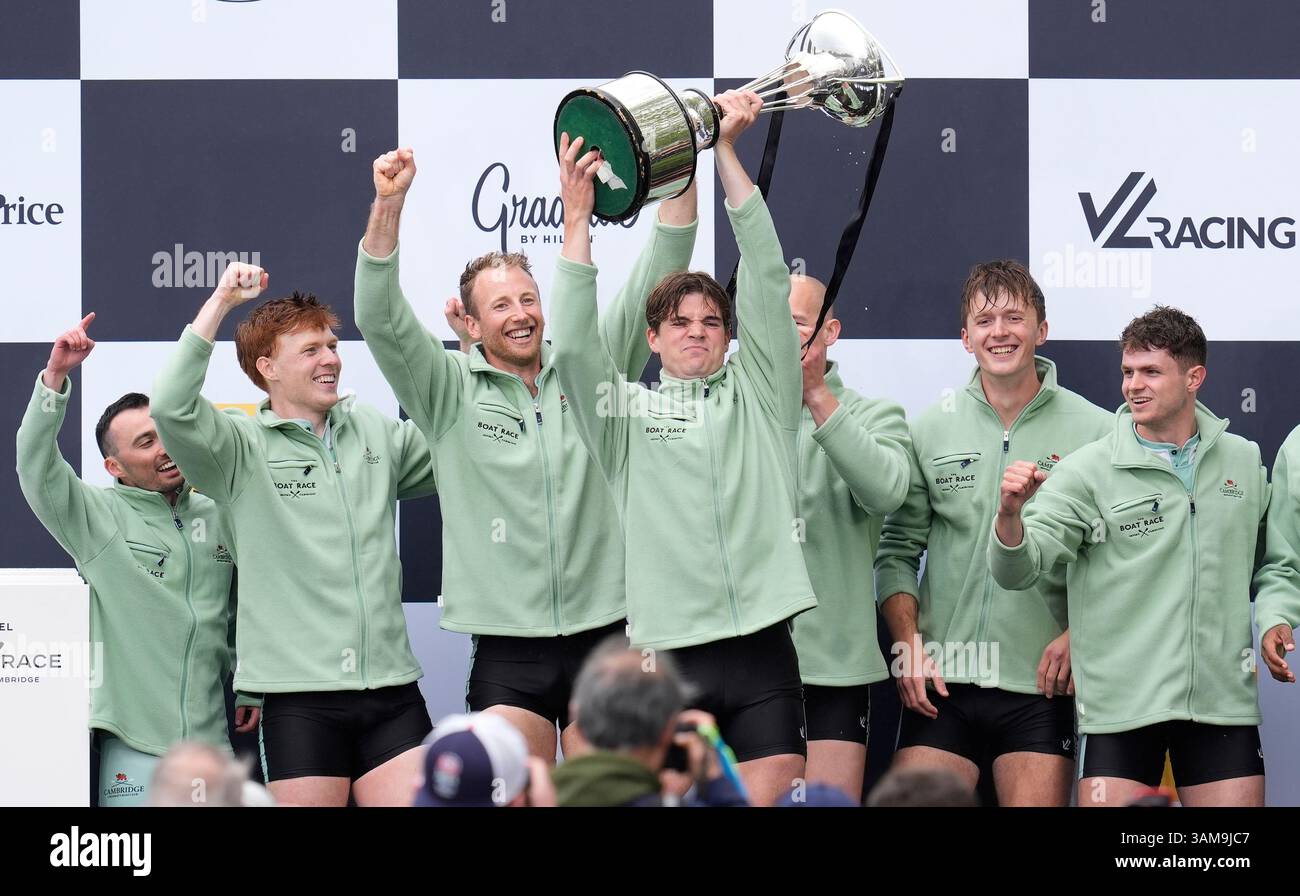 Cambridge Men's team president Luca Ferraro celebrates with the trophy ...