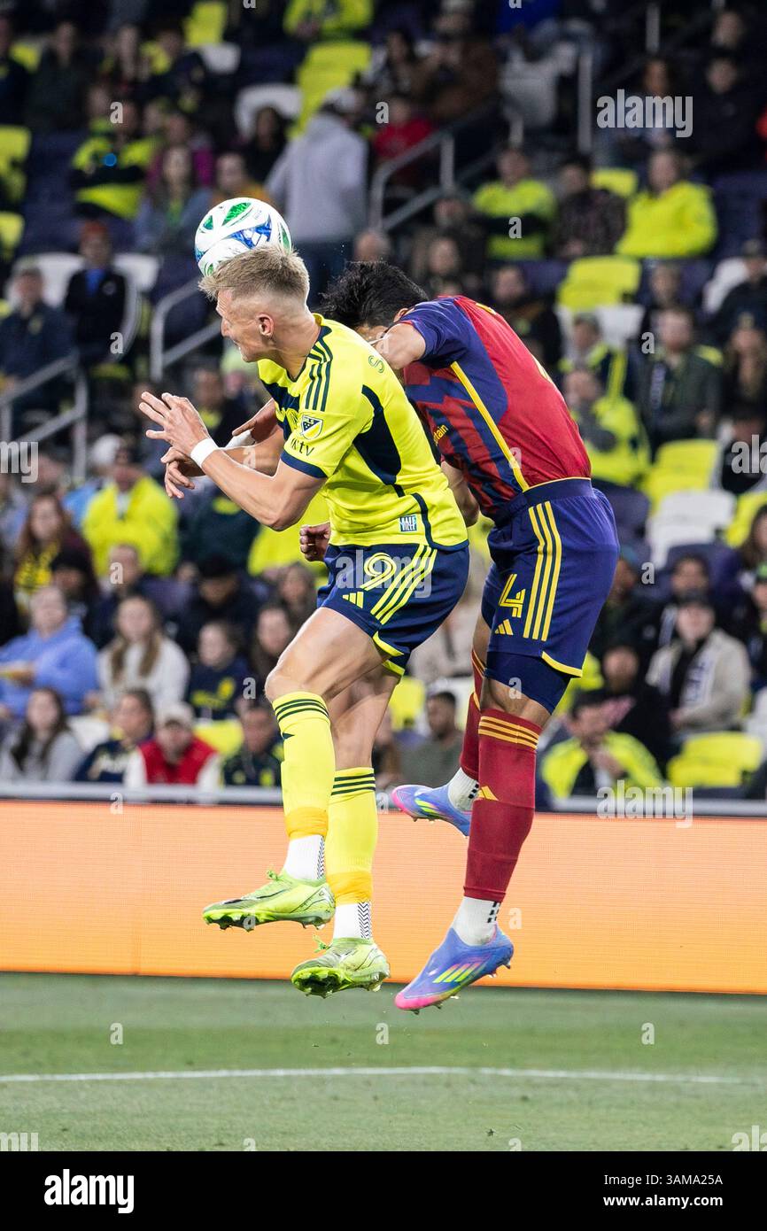 Nashville SC forward Sam Surridge (9) and Real Salt Lake defender Brayan Vera (4) jump to head ...