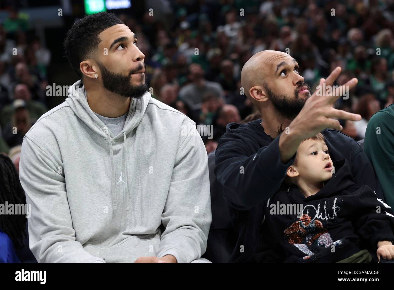 Boston Celtics' Jayson Tatum, left, and Derrick White watch from the ...