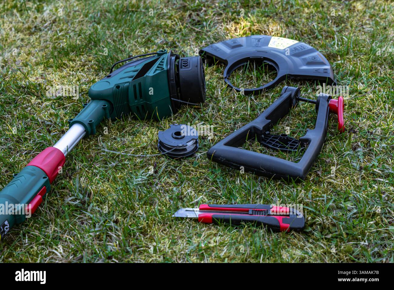 Battery-powered lawn mower, cordless trimmer placed on the lawn, new ...