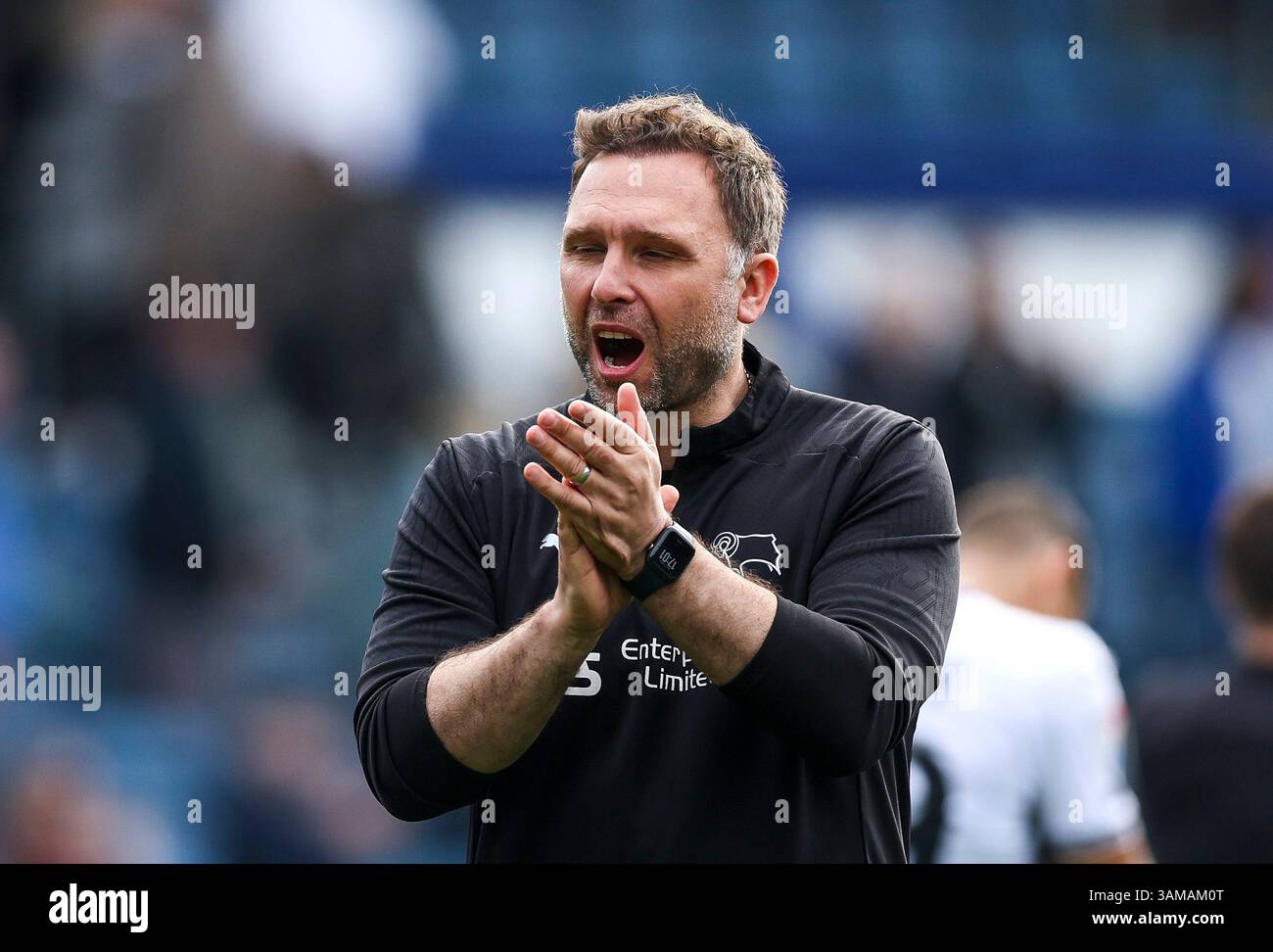 Derby County manager John Eustace applauding the fans at full time ...
