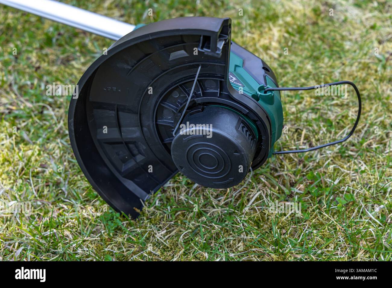 Battery-powered lawn mower, cordless trimmer placed on the lawn, new ...