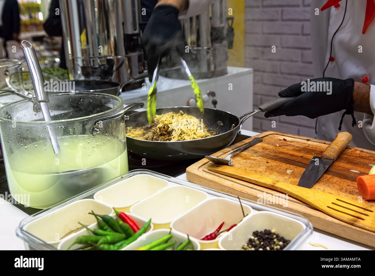 Hand tongs preparing pasta hi-res stock photography and images - Alamy