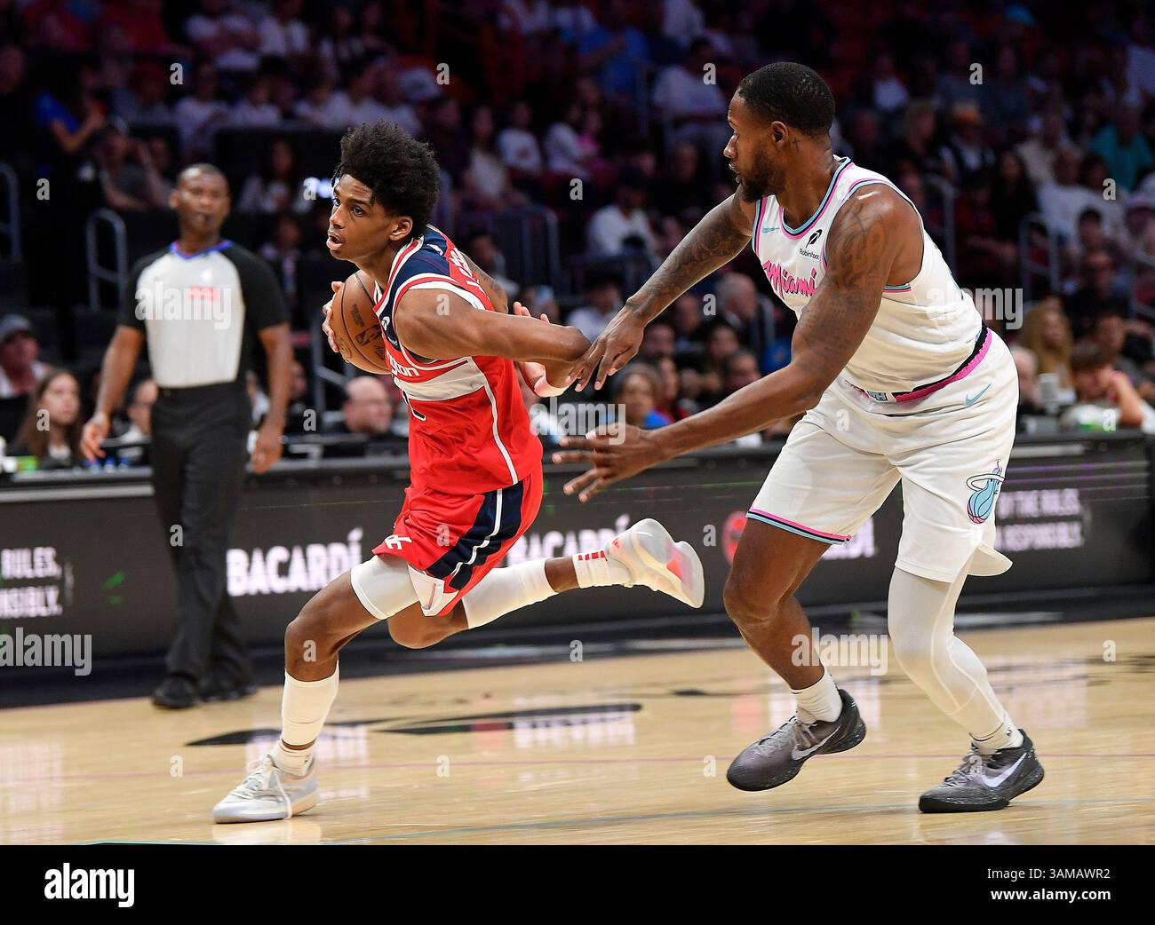 Washington Wizards guard AJ Johnson (5) drives on Miami Heat forward ...