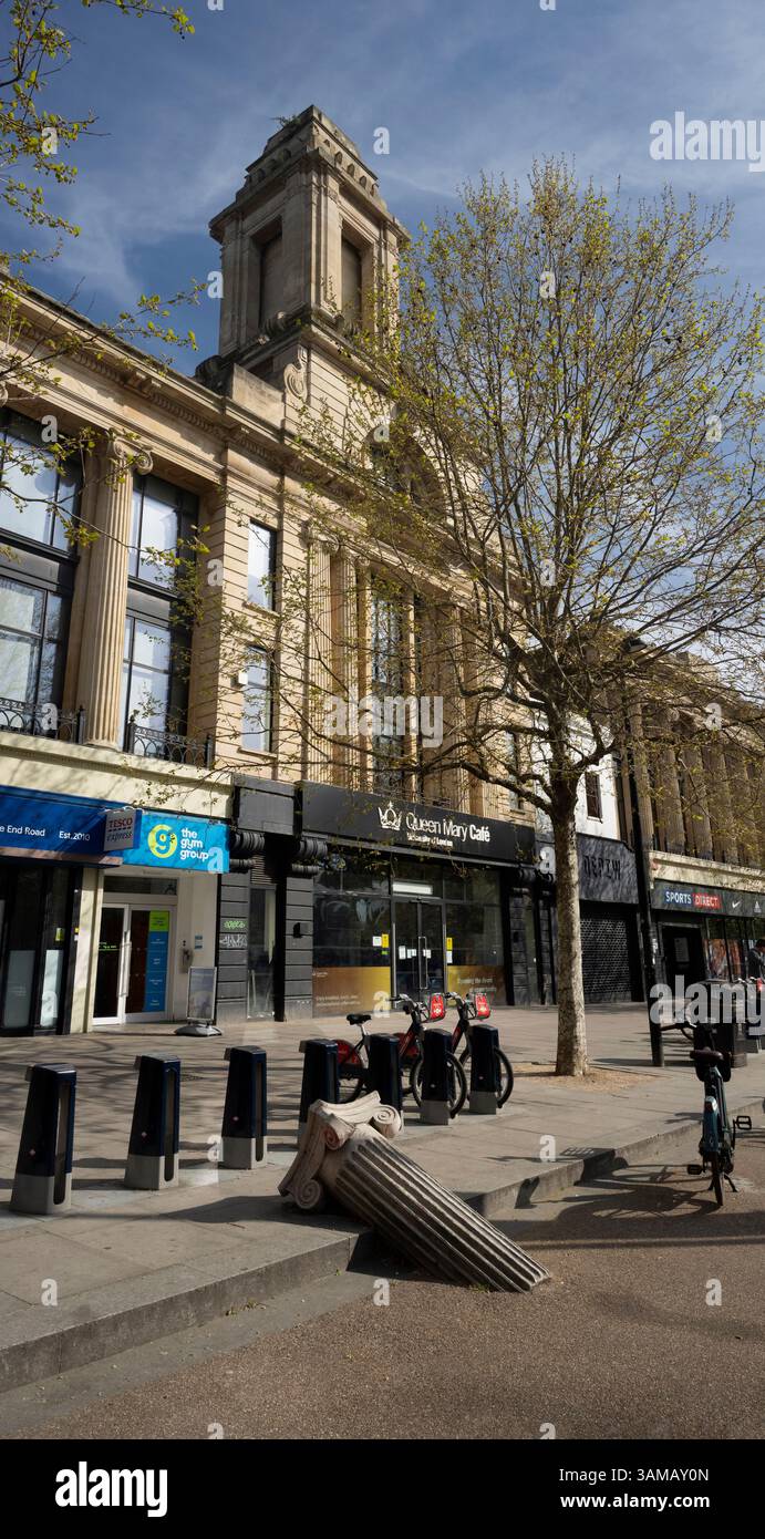 A fallen column lies on Mile End Road, London, near Queen Mary ...