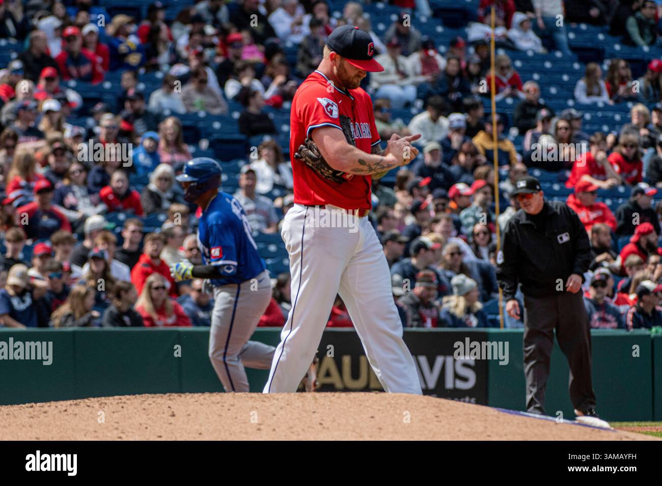 Cleveland Guardians starting pitcher Ben Lively turns away as Kansas ...