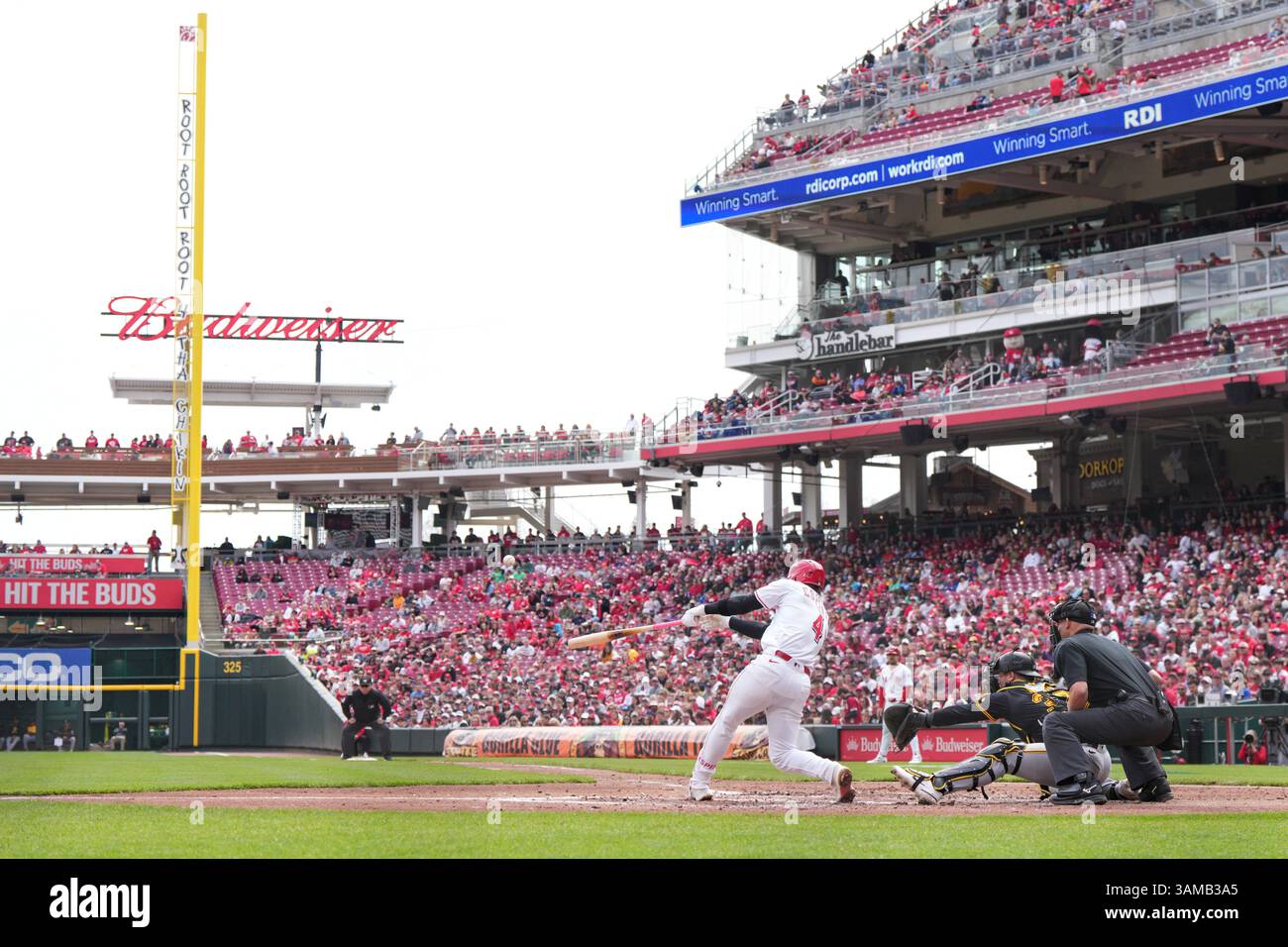 Cincinnati Reds' Santiago Espinal (4) hits a two-run single during the ...