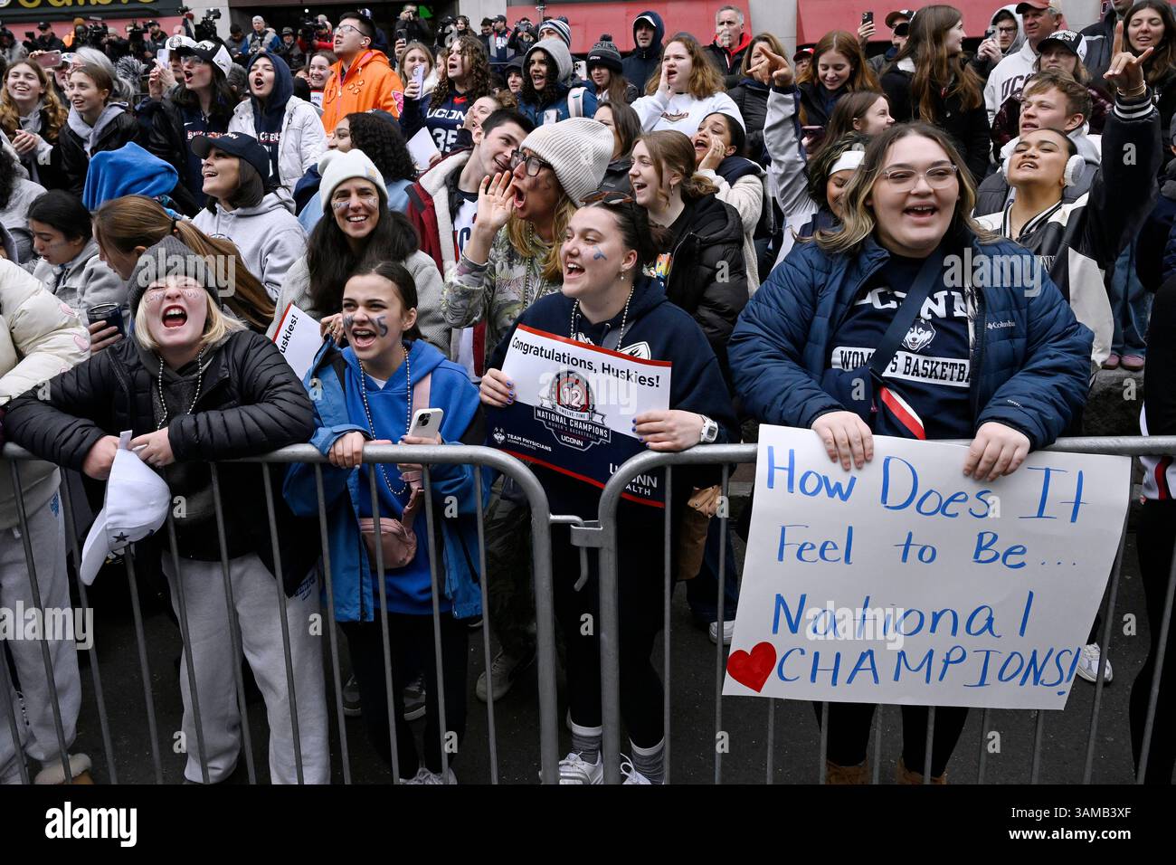 Fans cheer during a parade celebrating the Huskies' NCAA women's ...