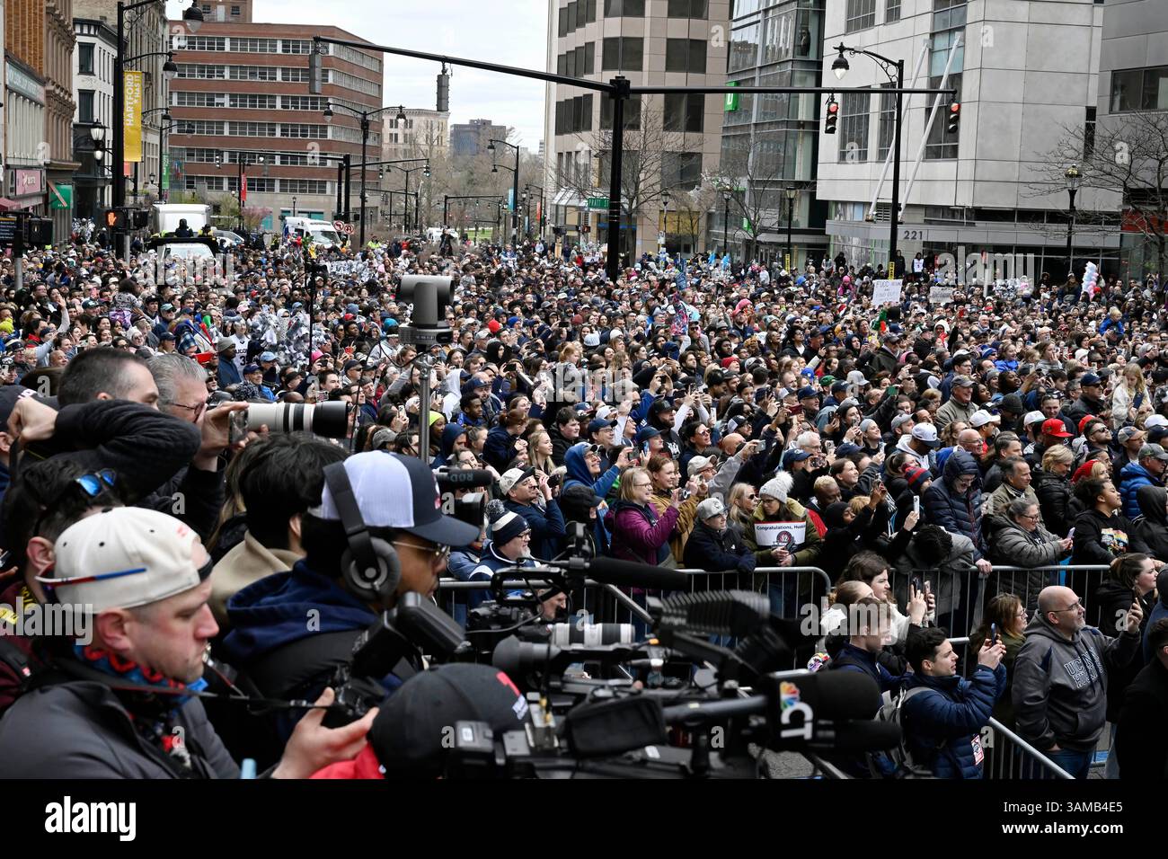 A large crowd gathers during a parade celebrating the Huskies' NCAA ...