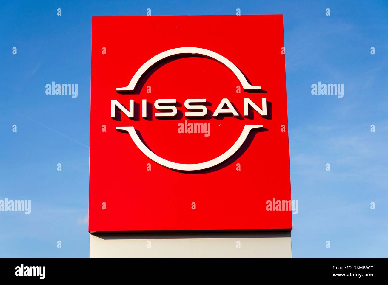 Nissan motor company logo on dealership building on April 12, 2025 in ...