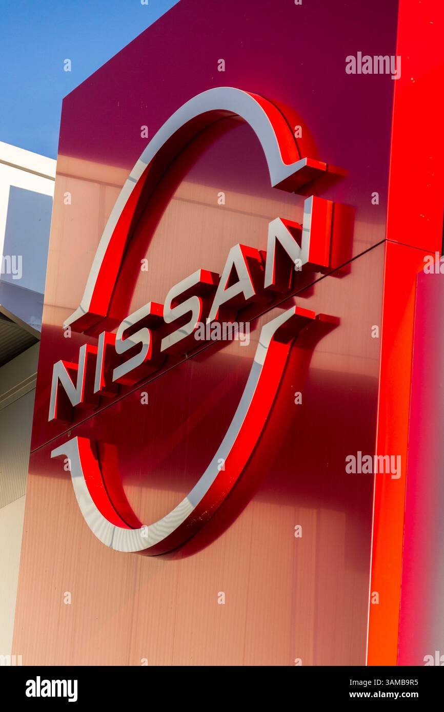 Nissan motor company logo on dealership building on April 12, 2025 in ...