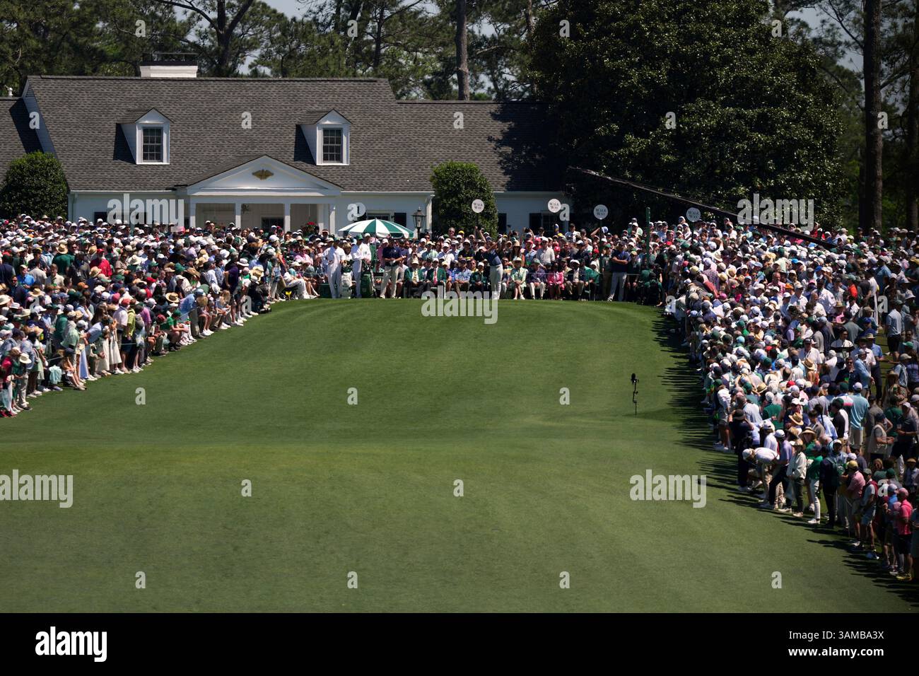 Rory McIlroy, of Northern Ireland, hits his tee shot on the first hole ...