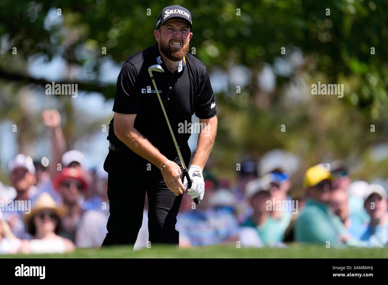 Shane Lowry, of Ireland, watches his tee shot on the fourth hole during ...