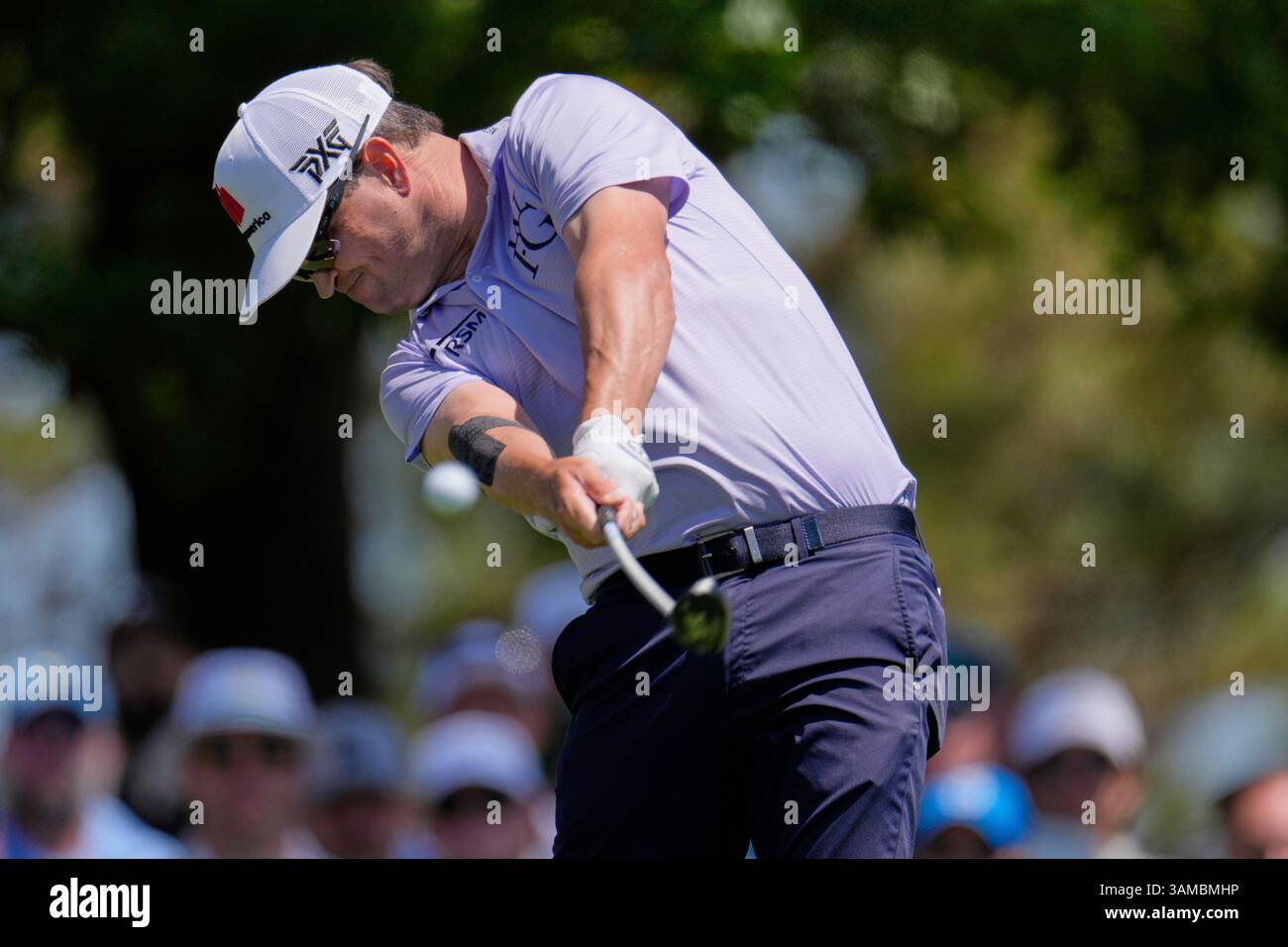 Zach Johnson hits his tee shot on the fourth hole during the final ...