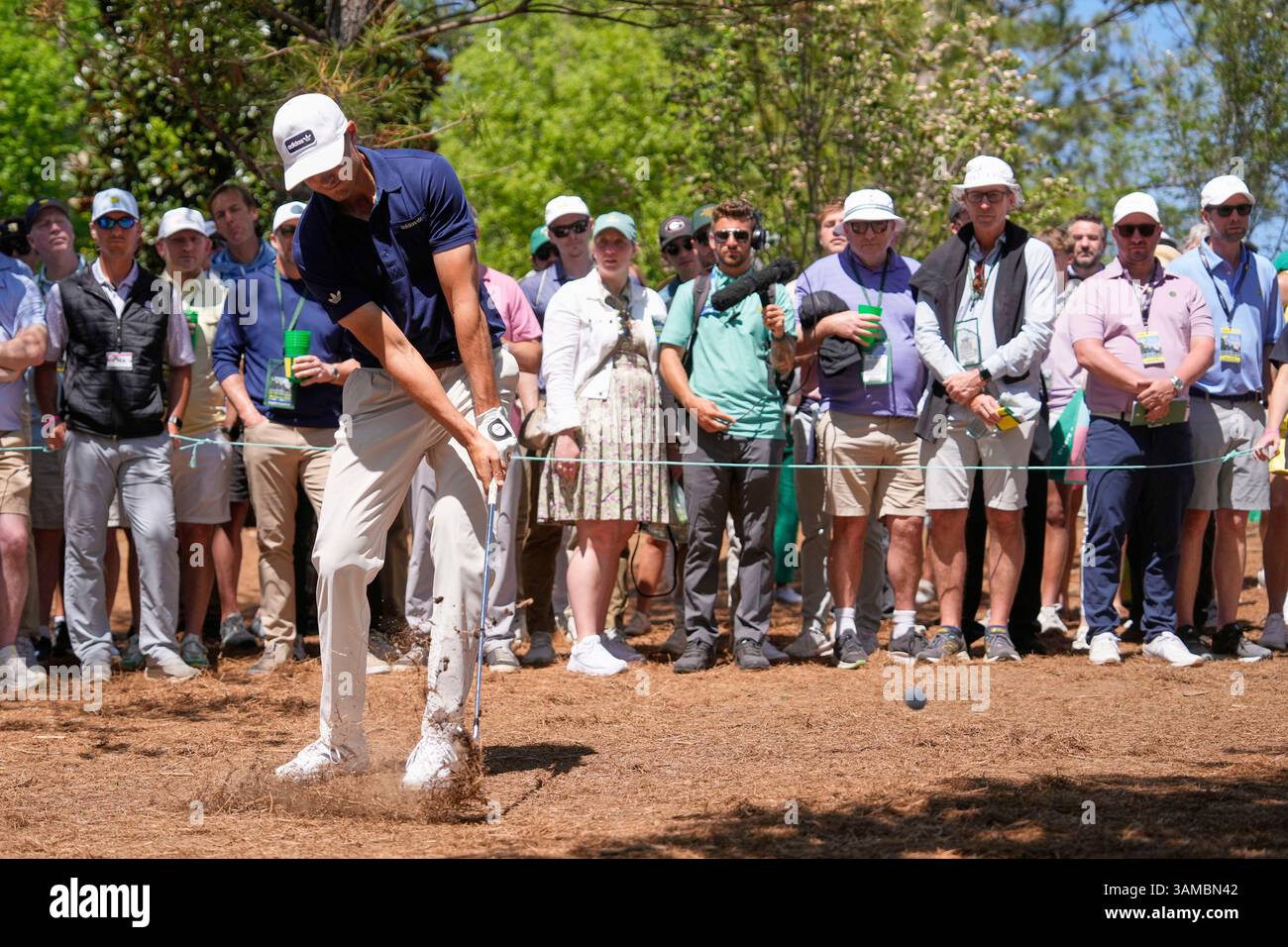 Ludvig Aberg, of Sweden, hits from the pine straw on the second hole ...