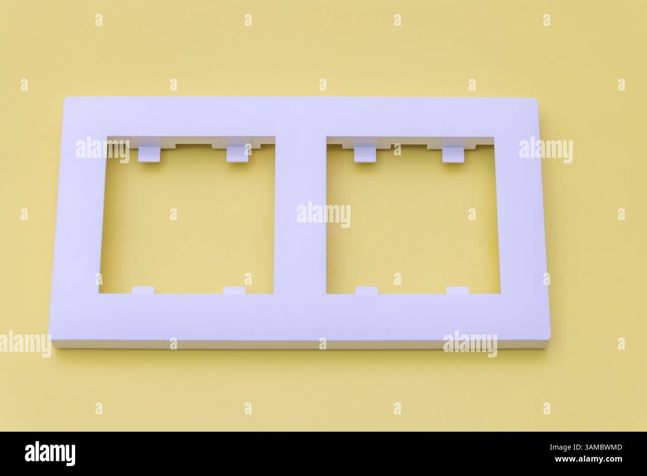 White plastic rectangular frame with two windows for an electrical tray ...