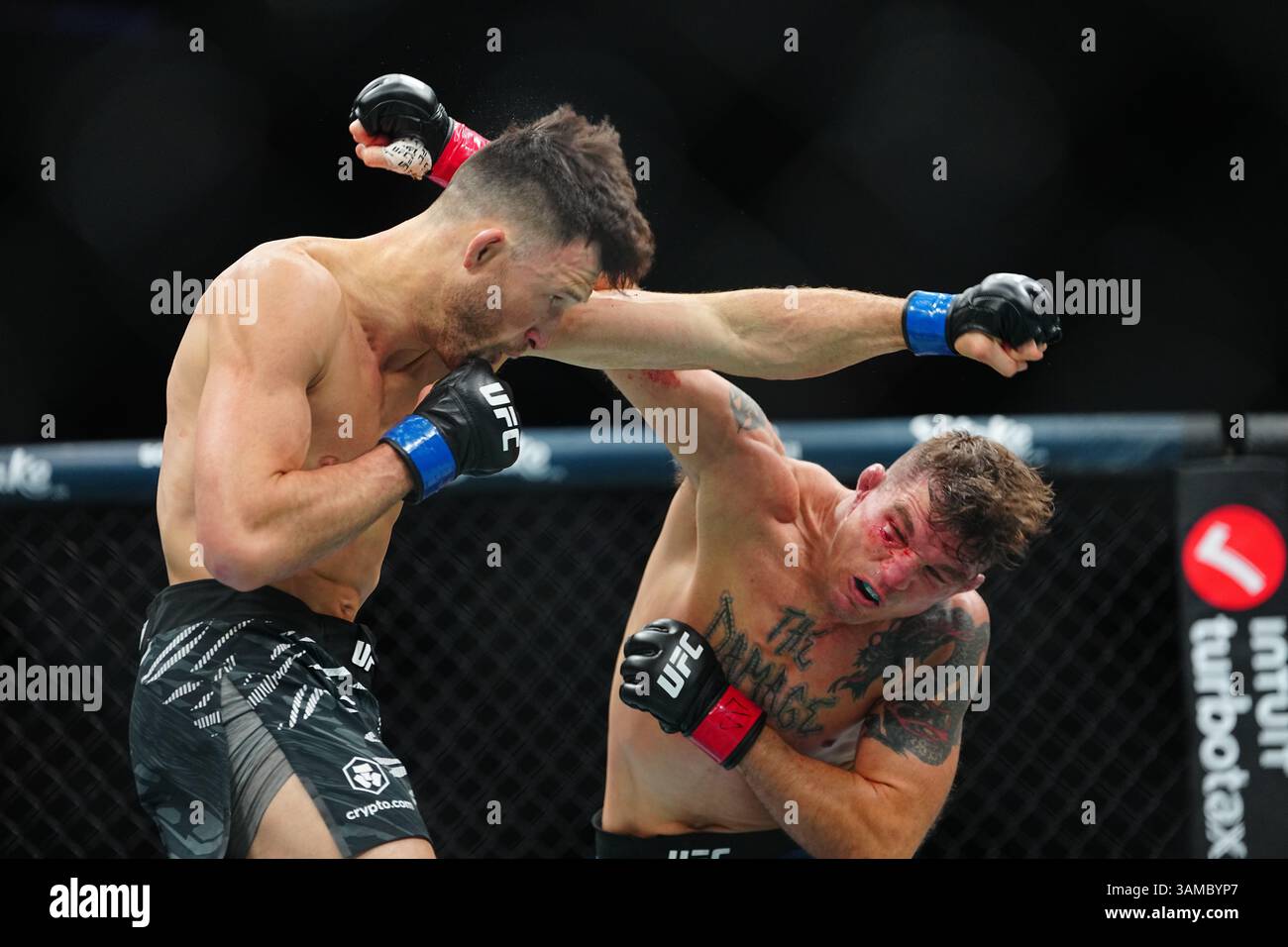 MIAMI, FL - APRIL 12:Darren Elkins and Julian Erosa meet in the octagon ...