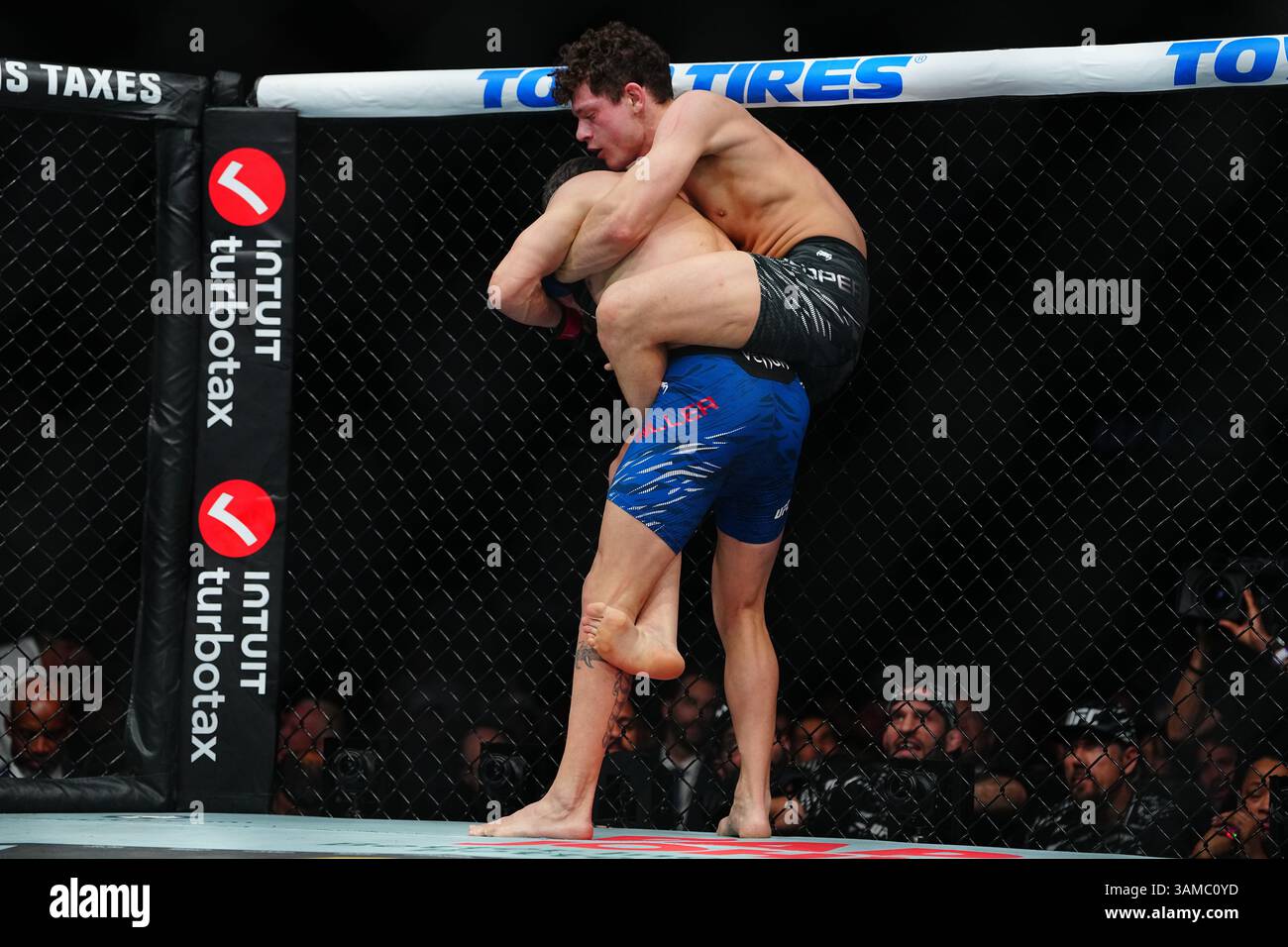 MIAMI, FL - APRIL 12:Jim Miller and Chase Hooper meet in the octagon ...