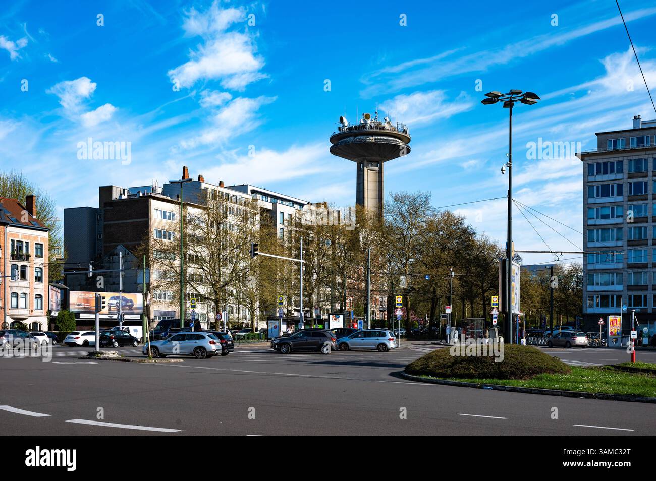Traffic at the Place Meiser with the broadcasting VRT RTBF tower in the ...