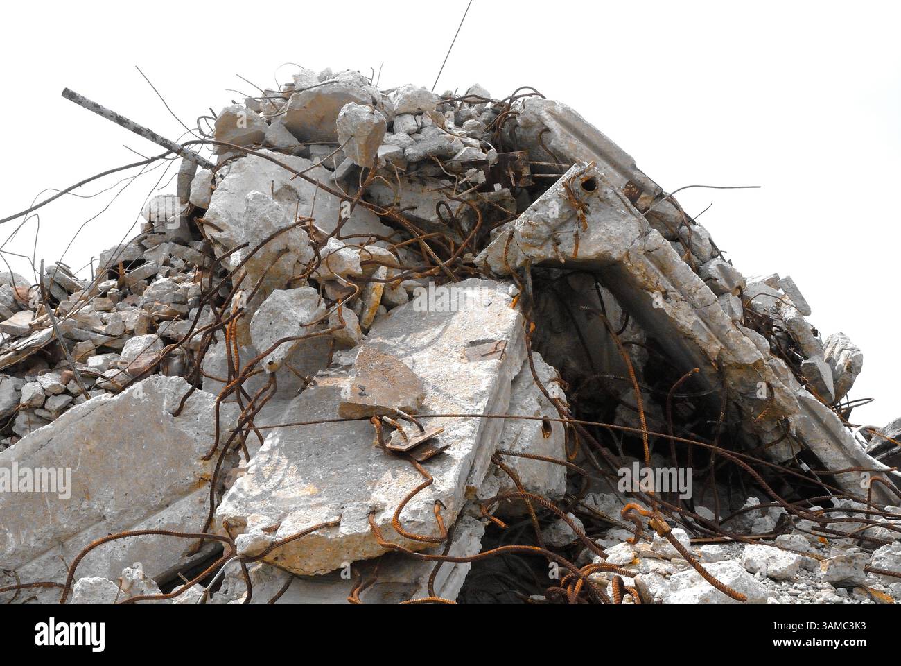 Pile of rubble with iron rods Stock Photo - Alamy