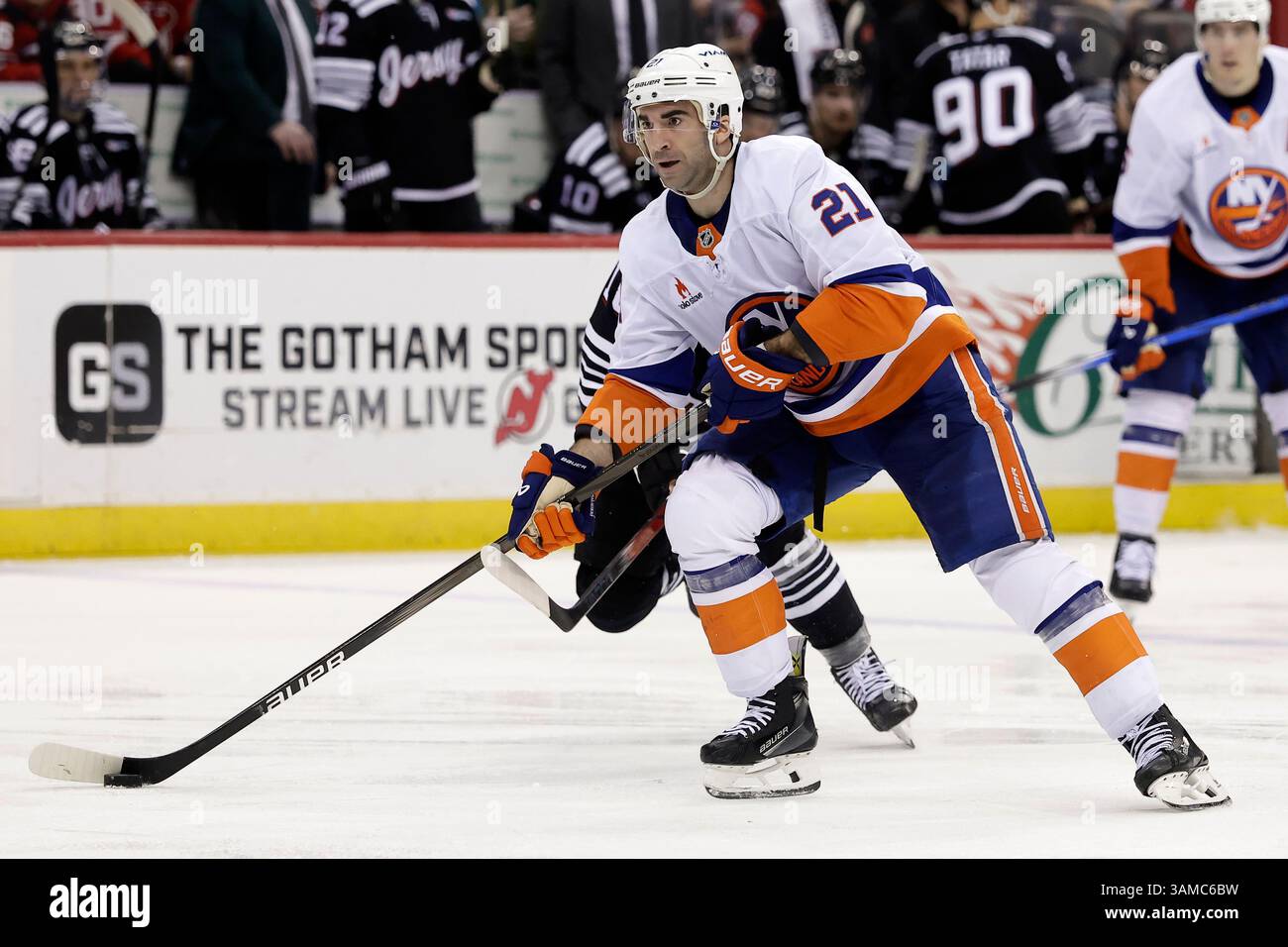 New York Islanders center Kyle Palmieri (21) controls the puck in the ...