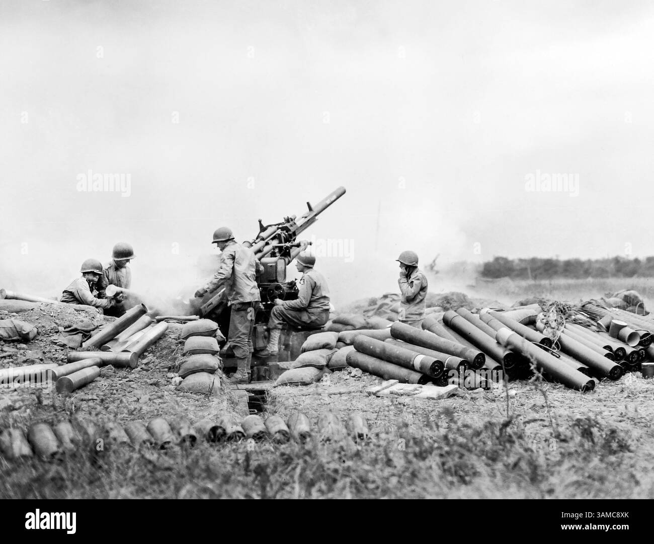 American gun battery of an anti-aircraft unit going into action on ...