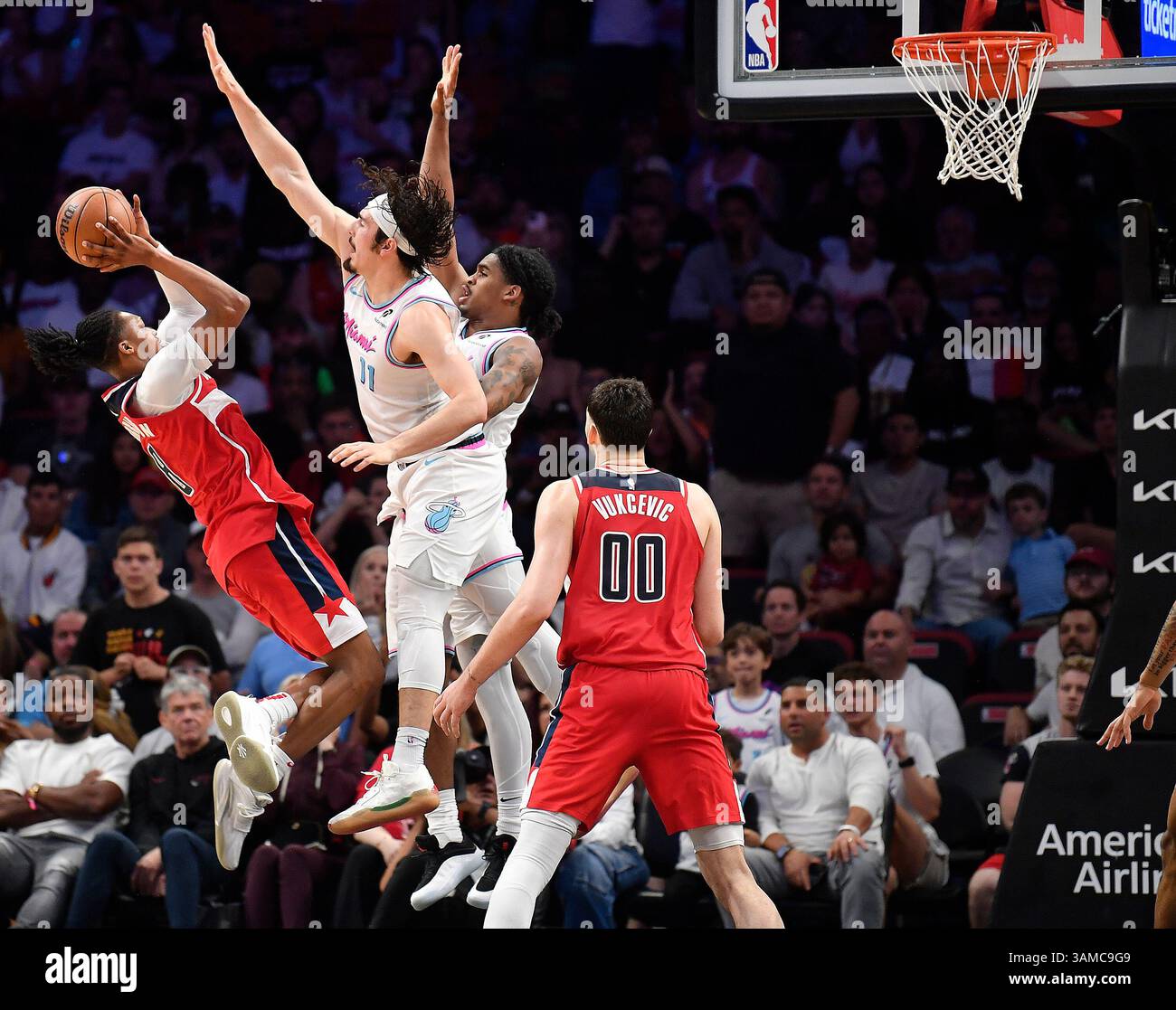 Washington Wizards guard Bub Carrington, left, takes a game-winning ...