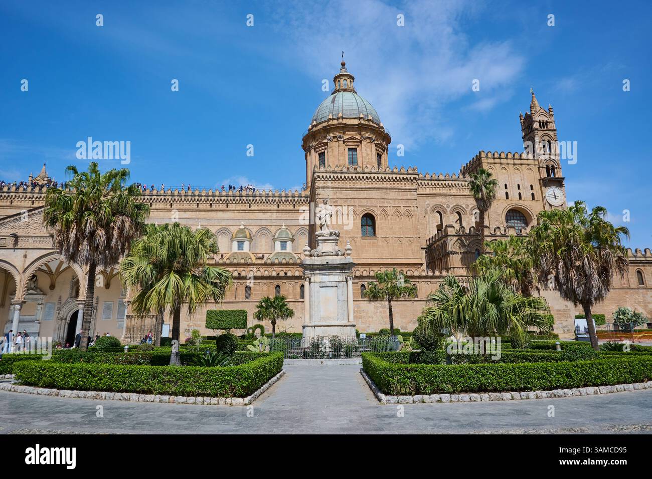 Stunning view of historic cathedral and gardens under a clear blue sky ...