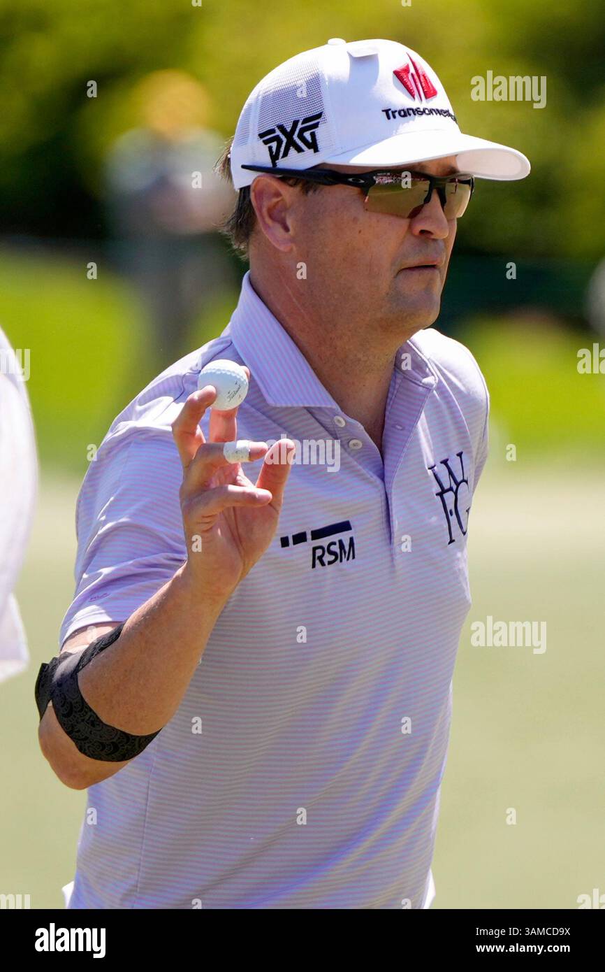 Zach Johnson waves after making a putt on the sixth hole during the ...