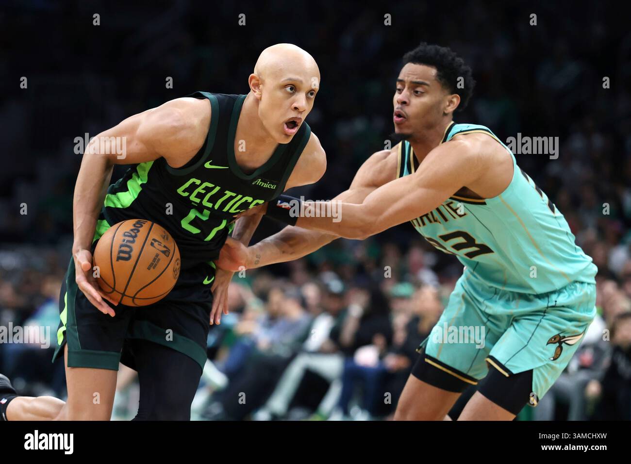 Boston Celtics' Jordan Walsh (27) drives past Charlotte Hornets' Jaylen ...