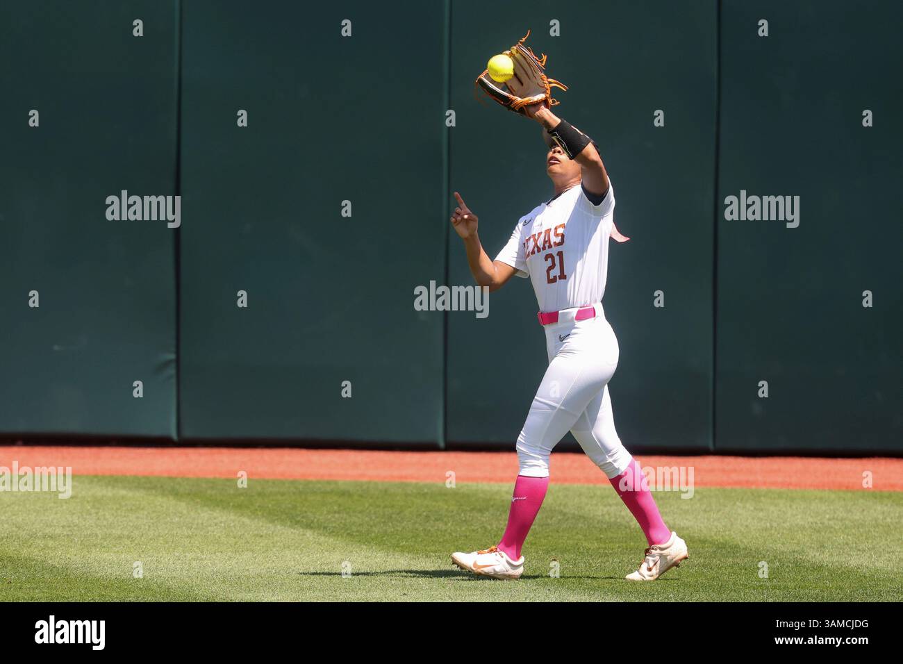 AUSTIN, TX - APRIL 13: Texas outfielder Kayden Henry (21) catches a fly ...
