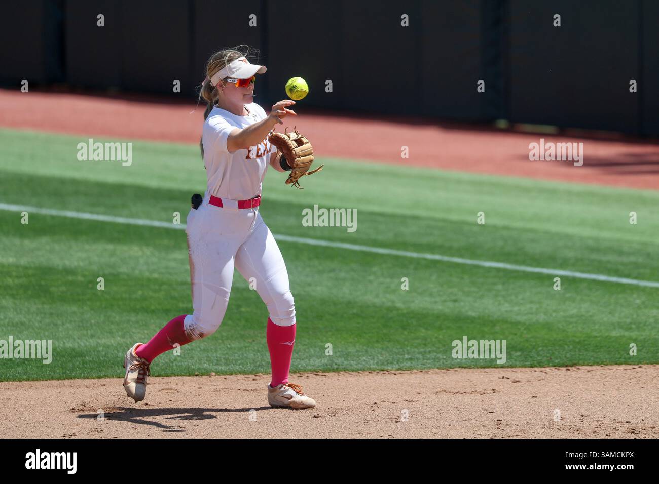 AUSTIN, TX - APRIL 13: Texas utility Kaydee Bennett (5) throws out a ...