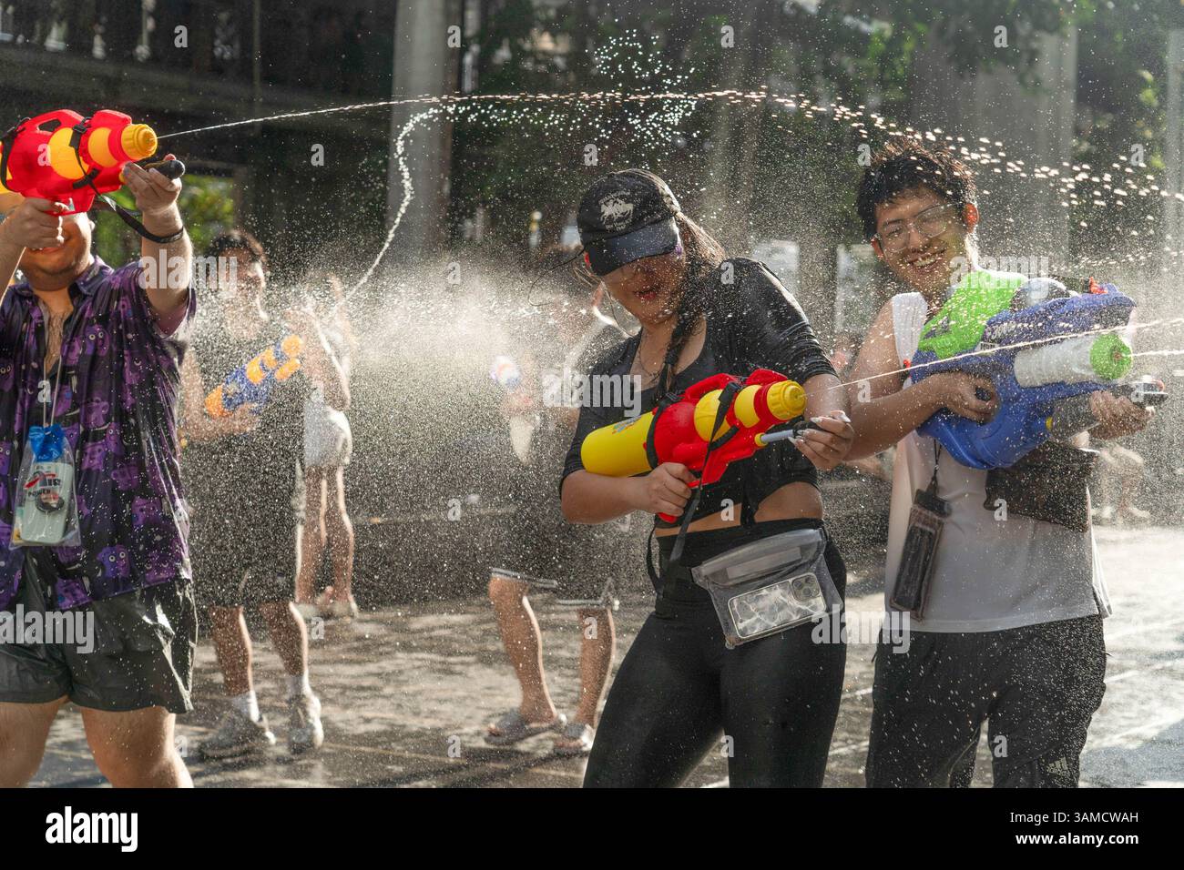 Bangkok, Thailand. 13th Apr, 2025. Tourists use water guns as they ...
