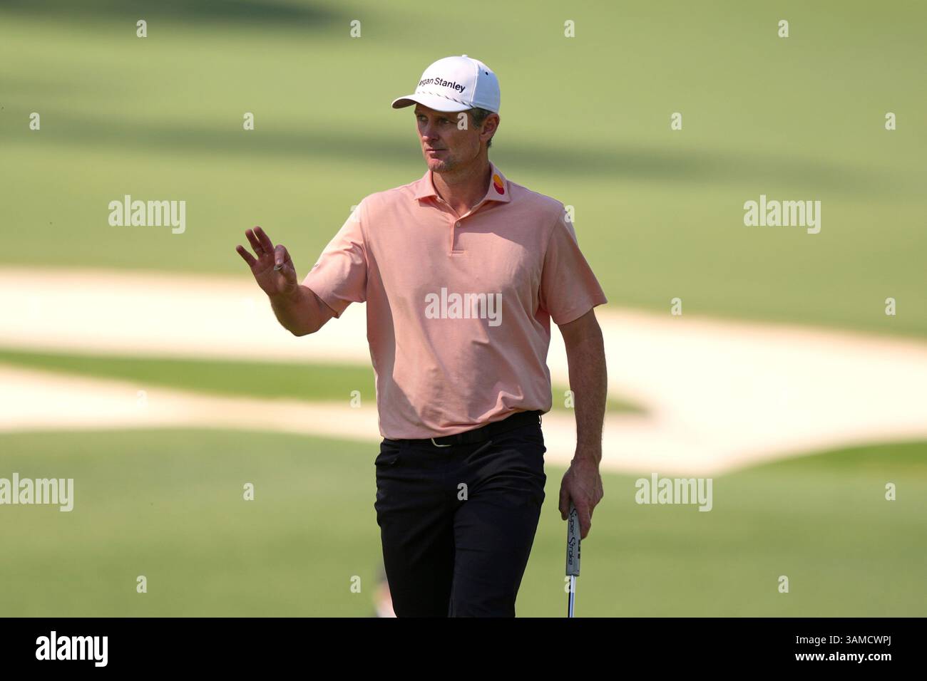 Justin Rose waves after making a putt on the 10th hole during the final ...