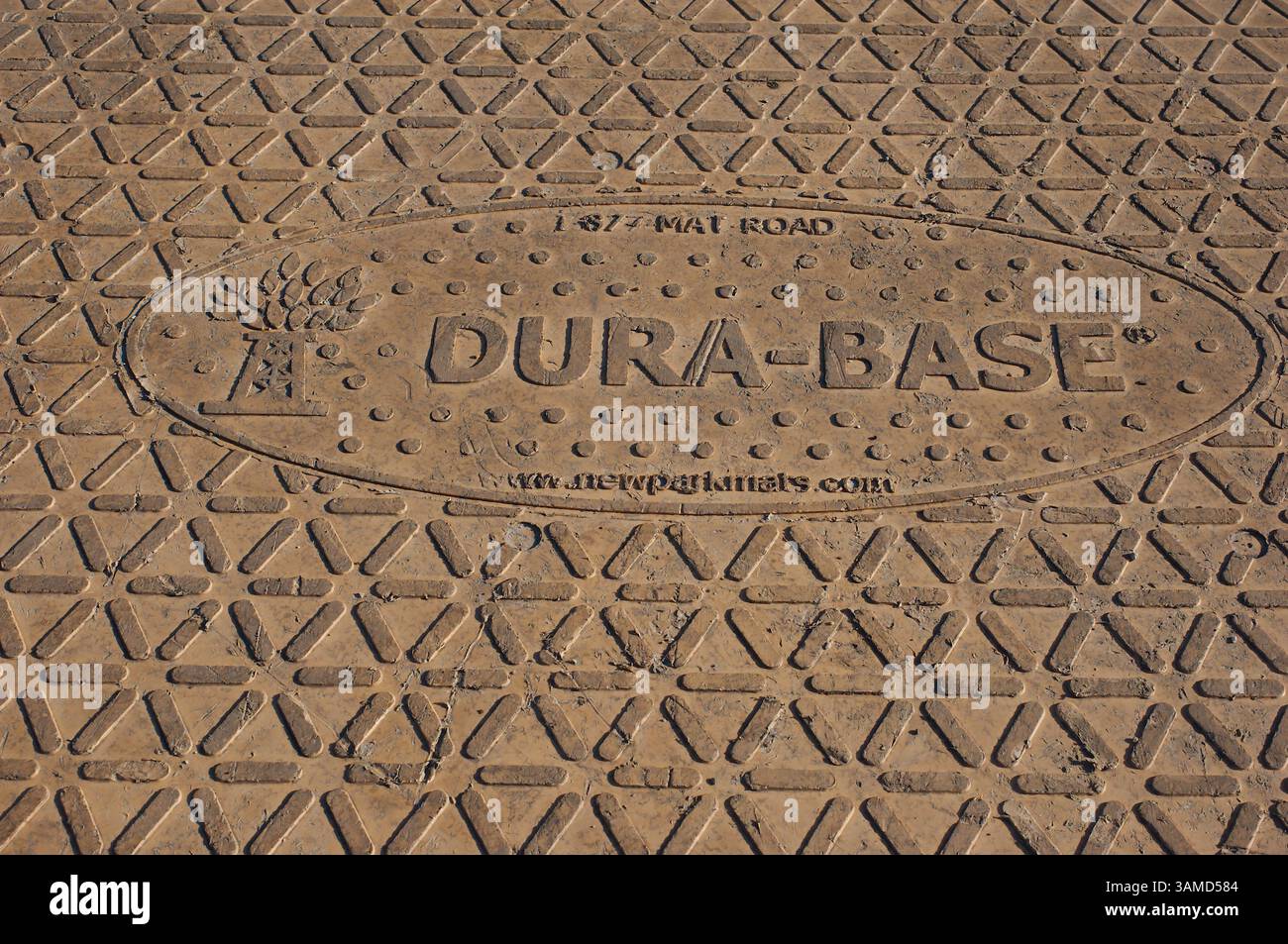 Close up view over sunny brown durable Dura Base Ground Mat with ...