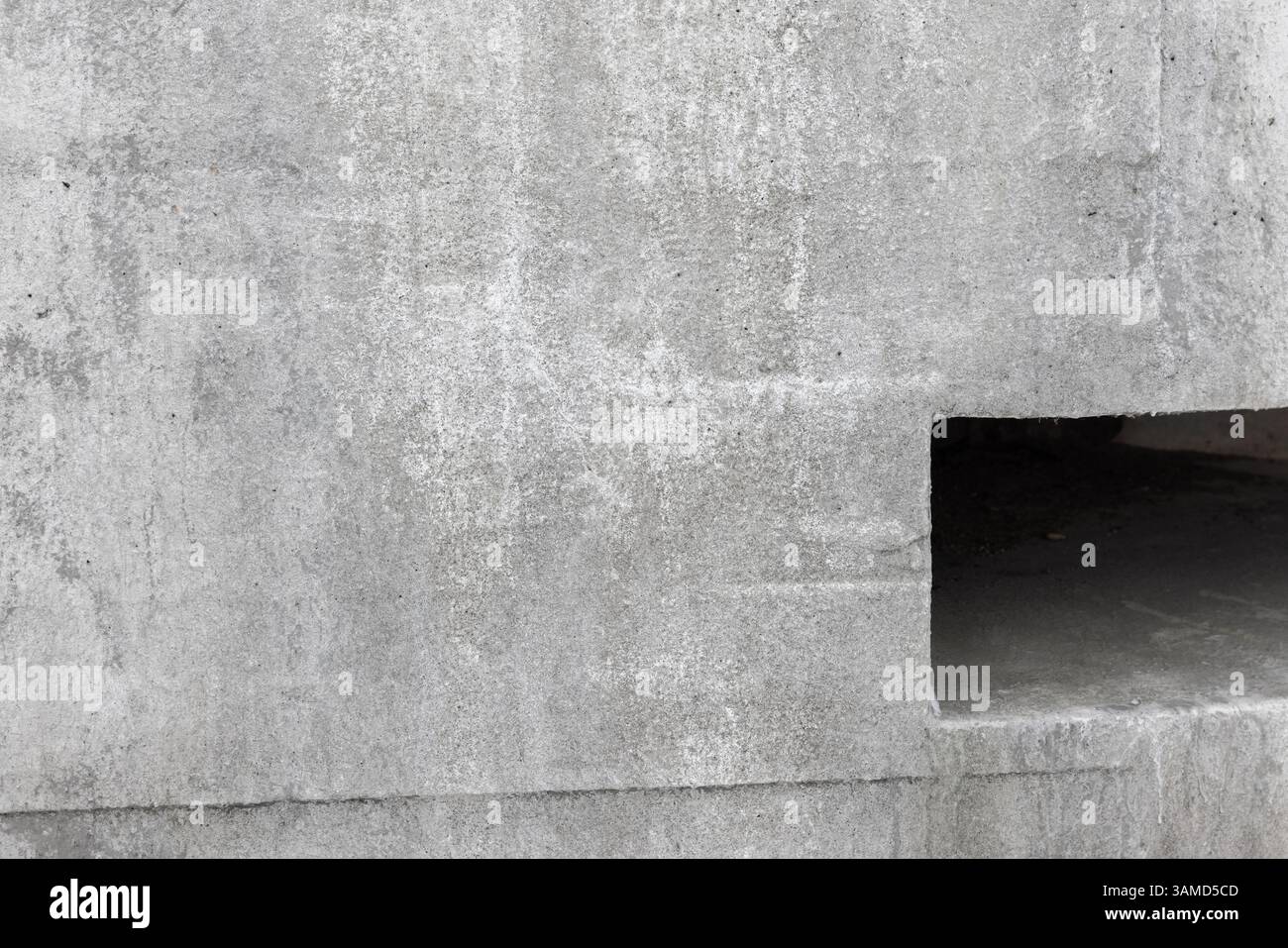 Abstract photo showcasing a textured concrete structure featuring an ...