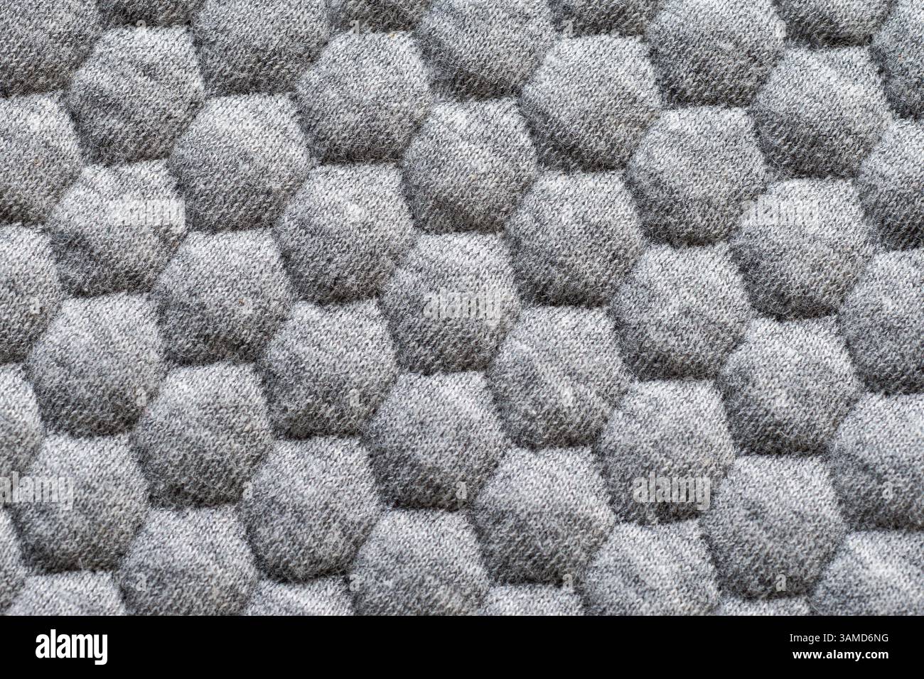 Textured grey fabric with hexagonal mesh pattern Stock Photo - Alamy